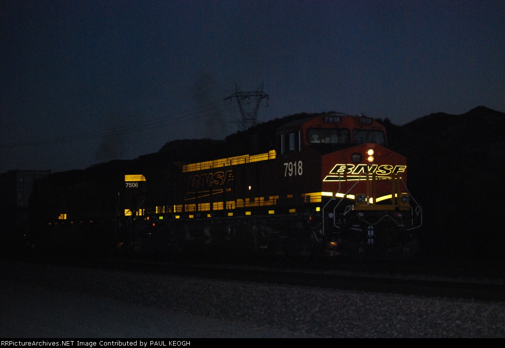 BNSF 7918 with BNSF 7506 in front of her light up their BNSF Swoosh Logo in this Dusk photo as ...